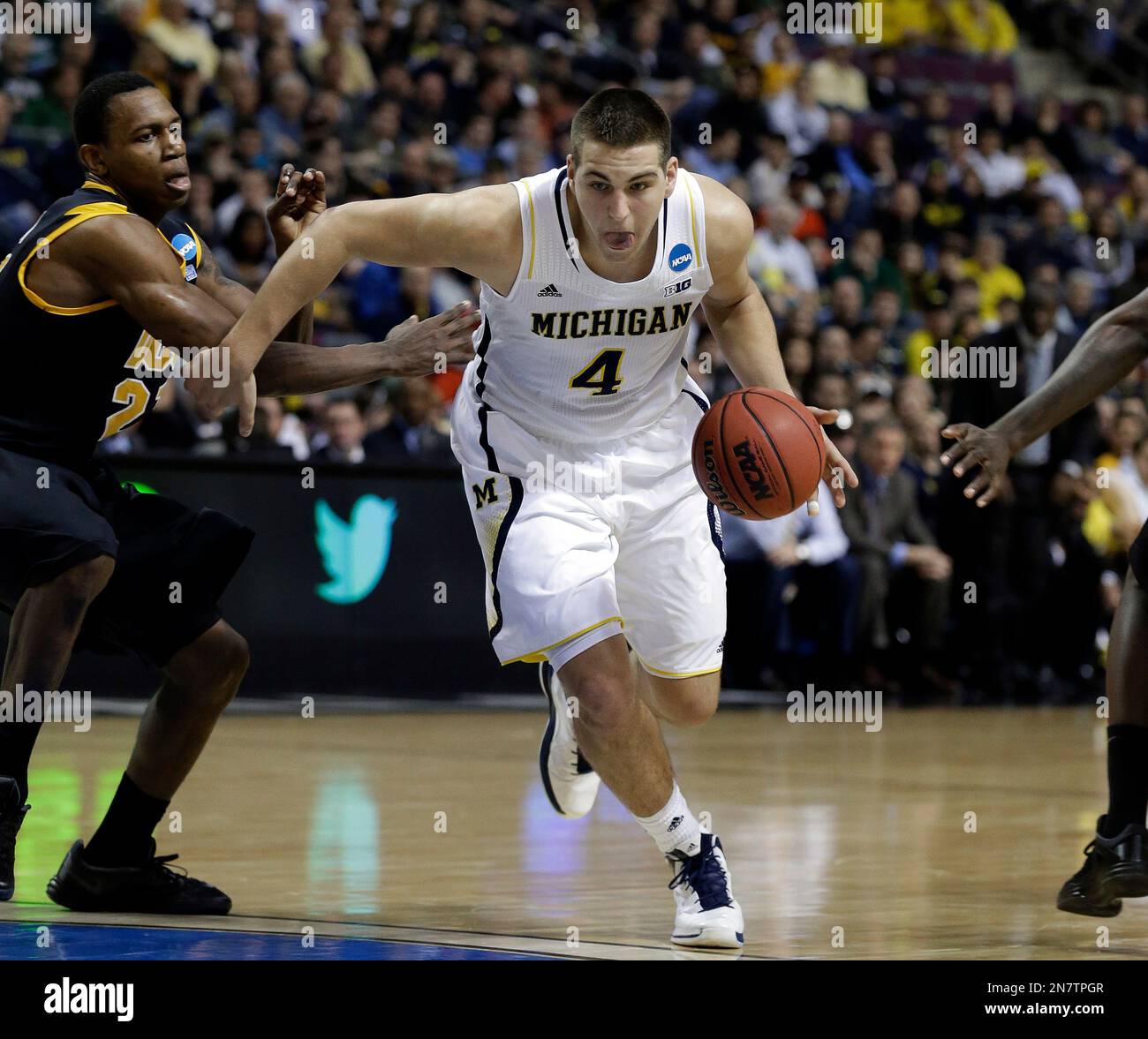 Michigan forward Mitch McGary (4) drives against Virginia Commonwealth ...