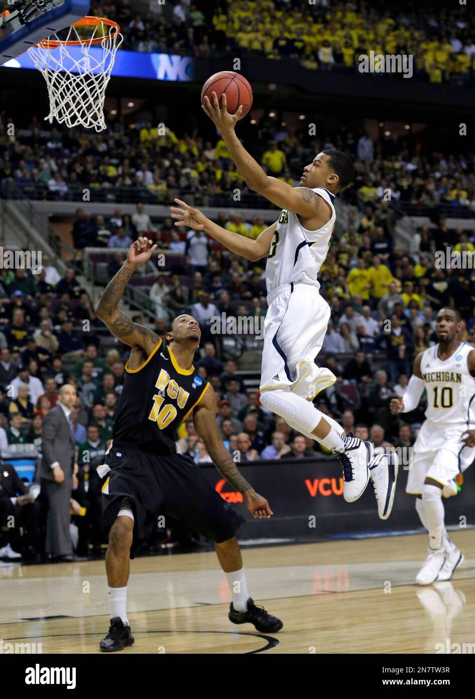 Michigan guard Trey Burke drives on Virginia Commonwealth guard Darius ...