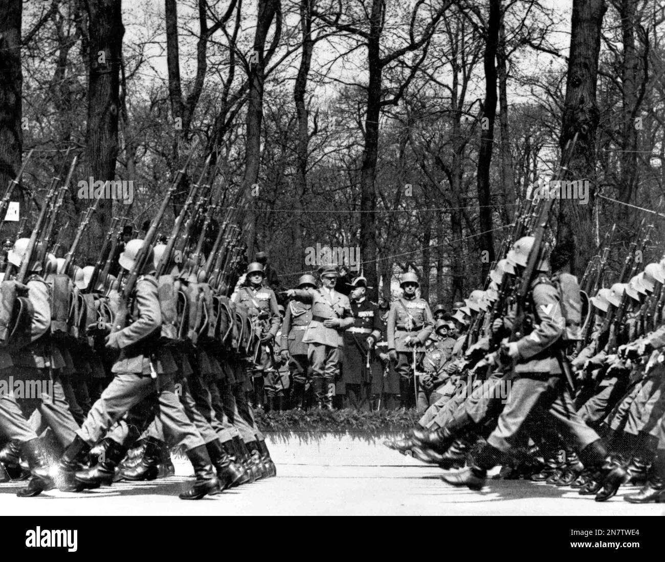 In this April 20, 1936 file photo, armed troops march past German ...