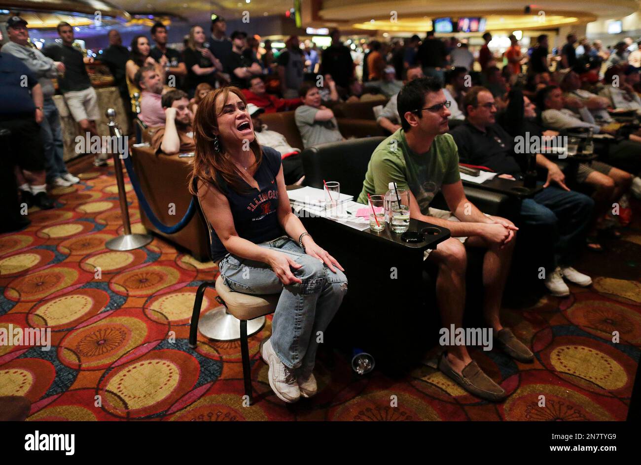Illinois fan Susie Supalo of Chicago, reacts as she watches Illinois ...