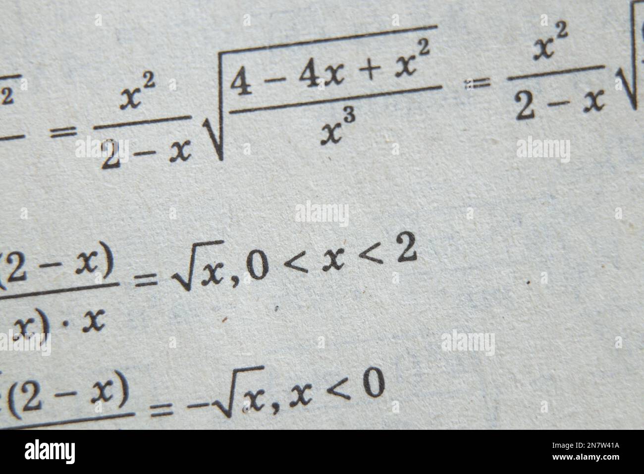algebra equation on old book page as background, algebra homework Stock ...
