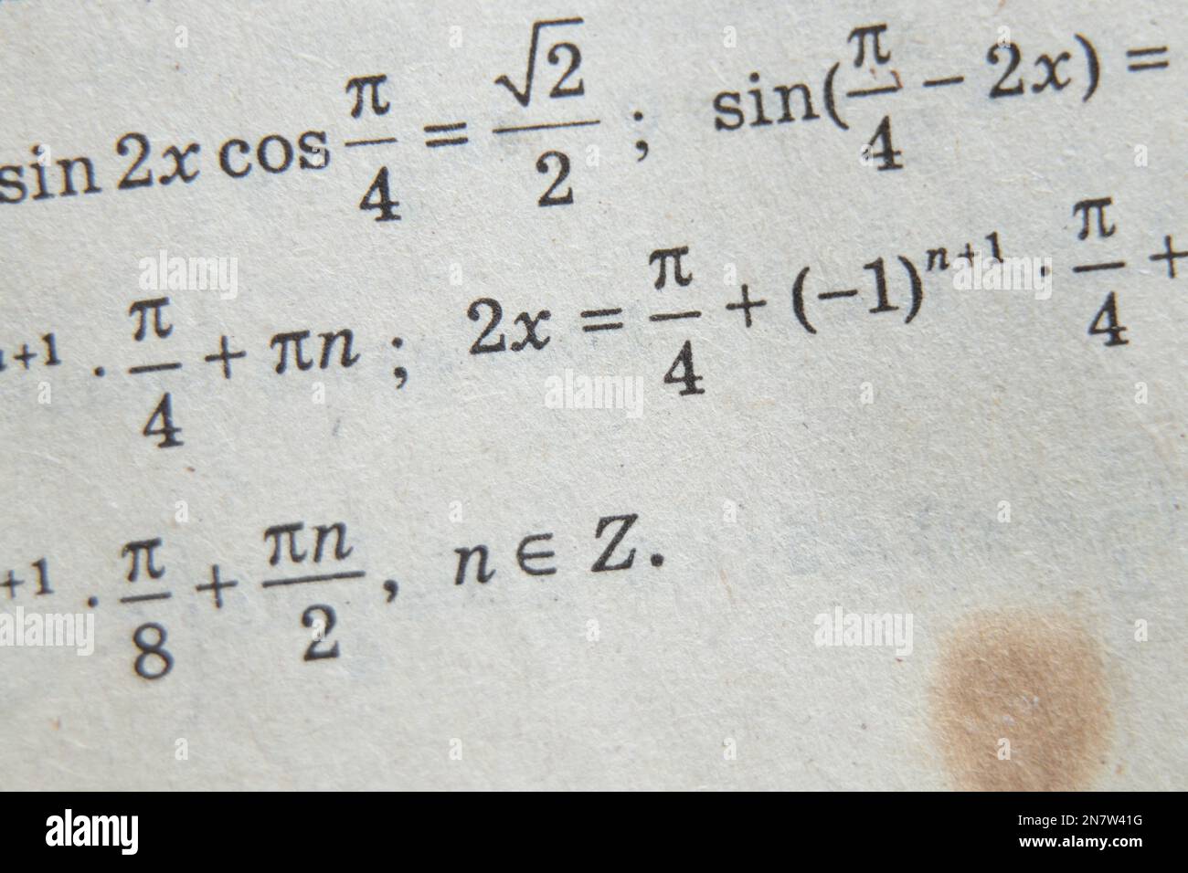algebra equation on old book page as background, algebra homework Stock ...