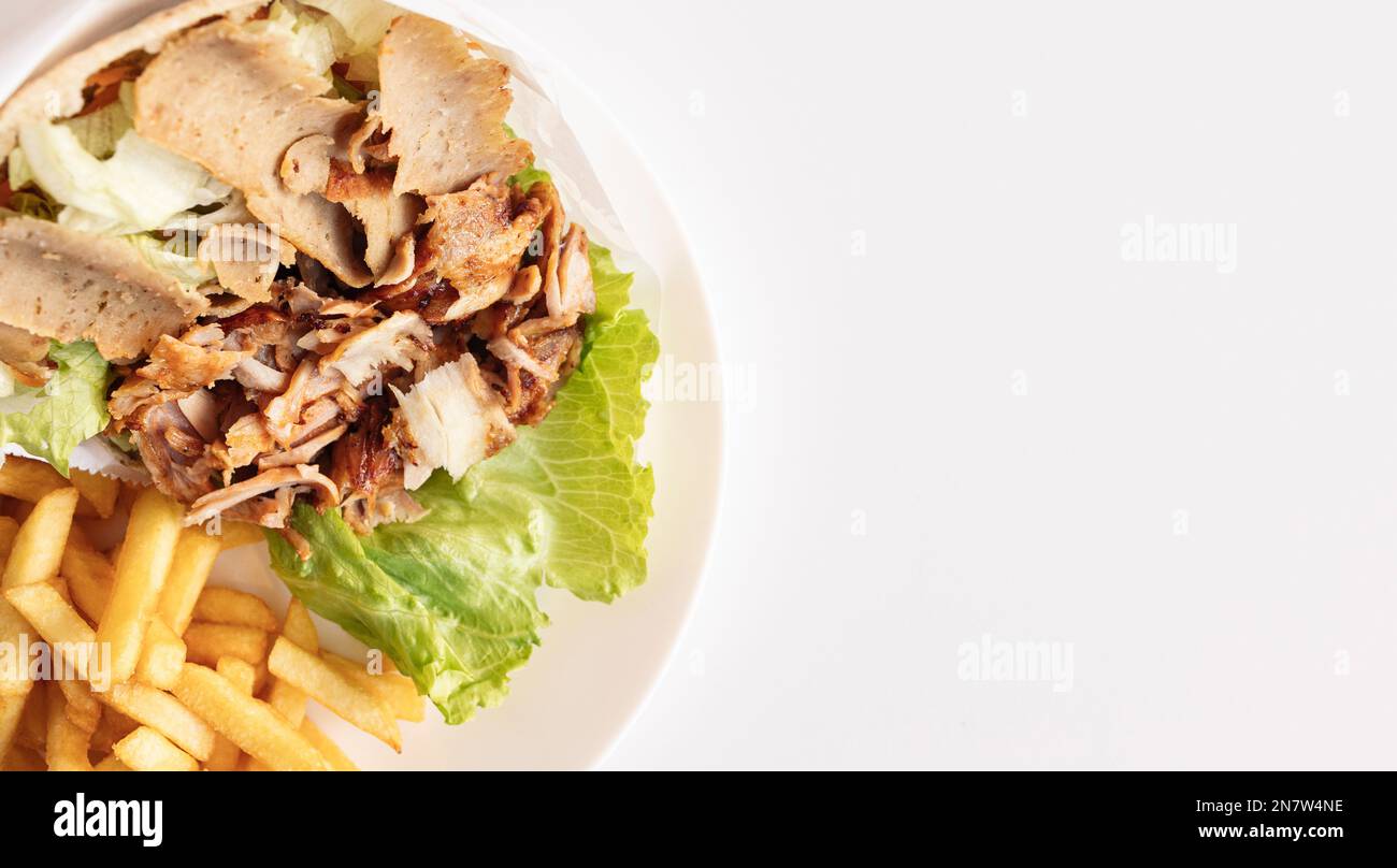 doner kebab with french fries on white background with space for text ...