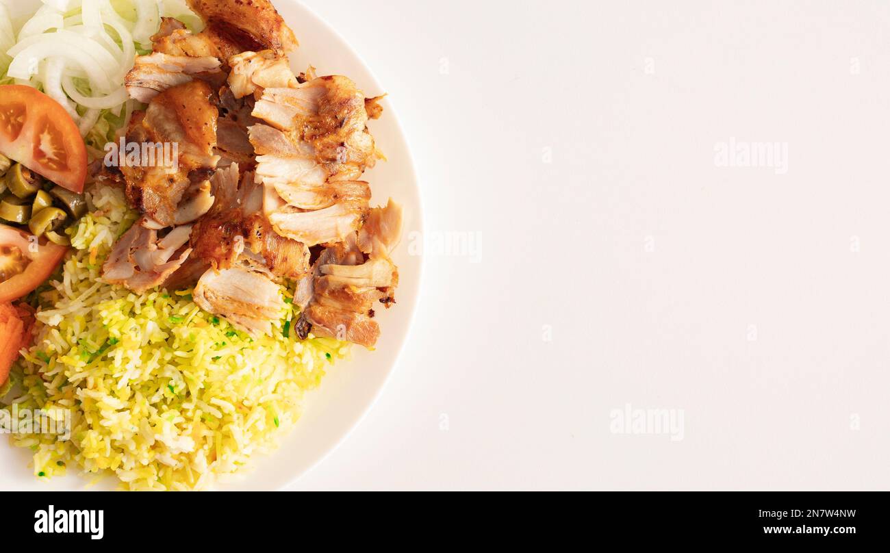 Kebab meat plate with rice and salad on white background with space for ...