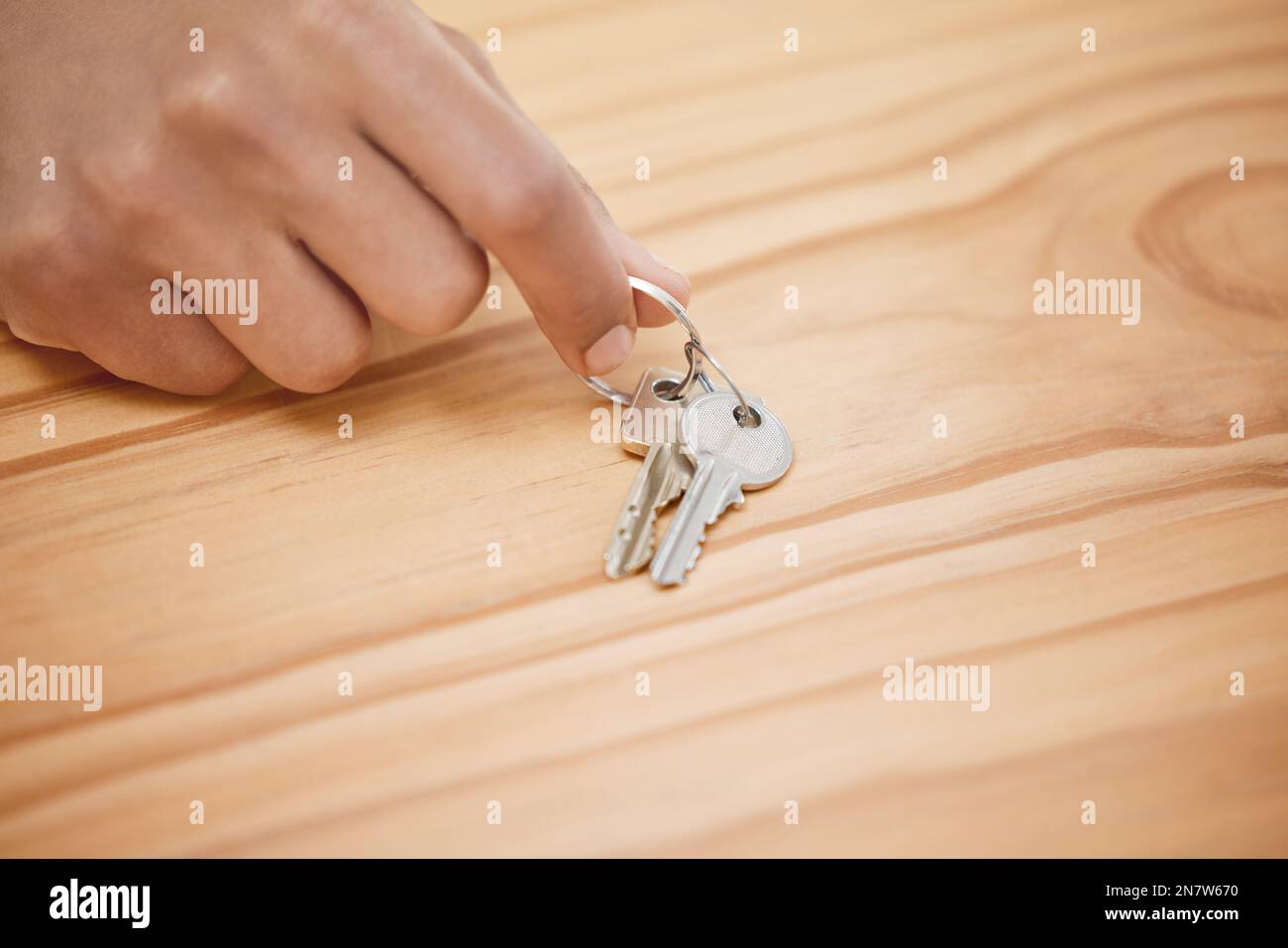 Can I take this now. an unrecognisable man taking a set of house keys ...