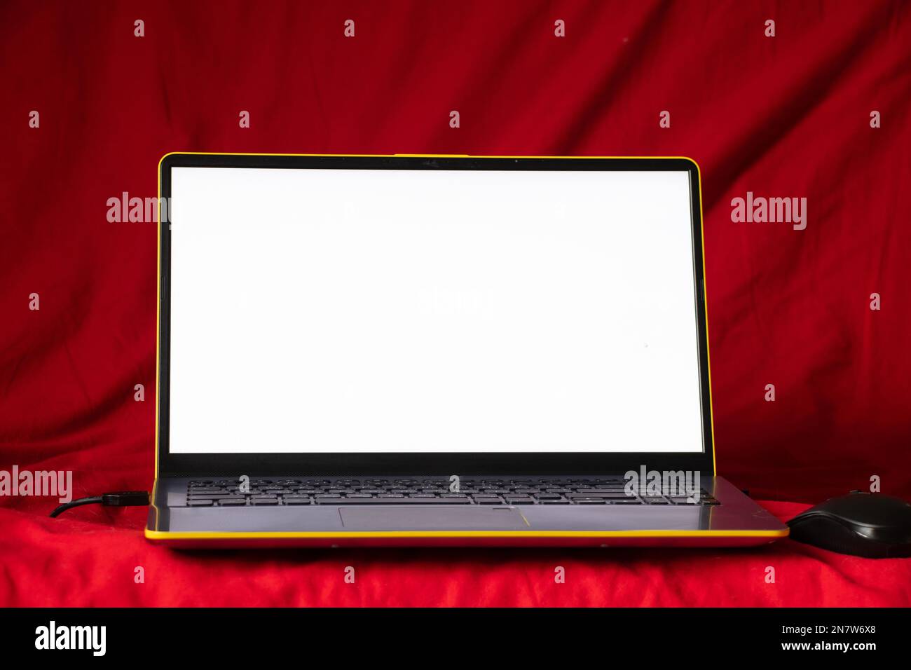 laptop with white screen on red background close up Stock Photo - Alamy