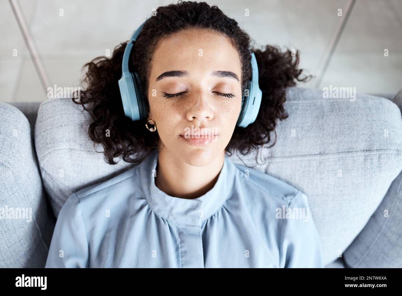Woman, face and headphones for listening to music for calm, peace and ...