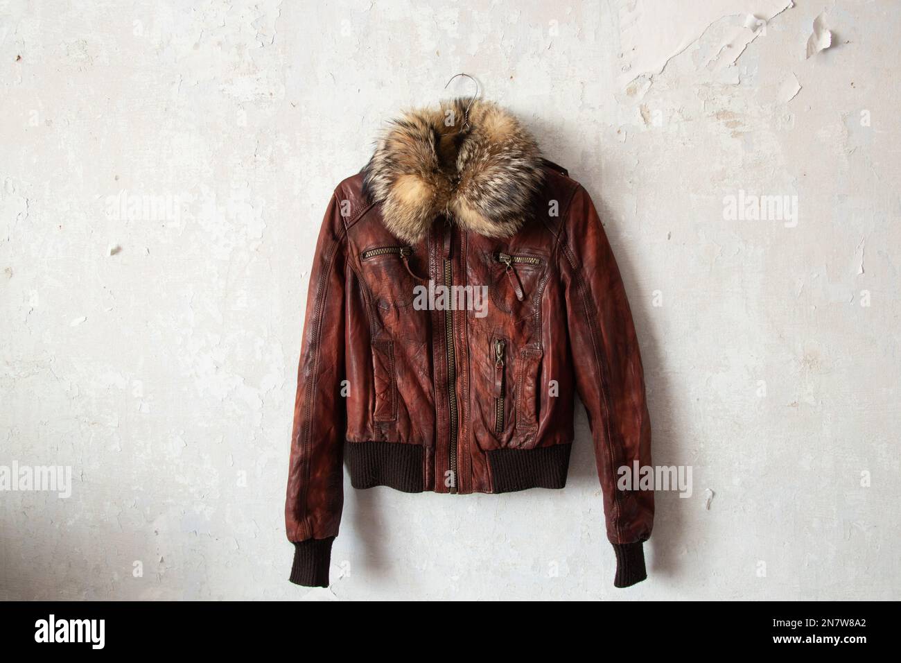 Hanging coat hi-res stock photography and images - Alamy