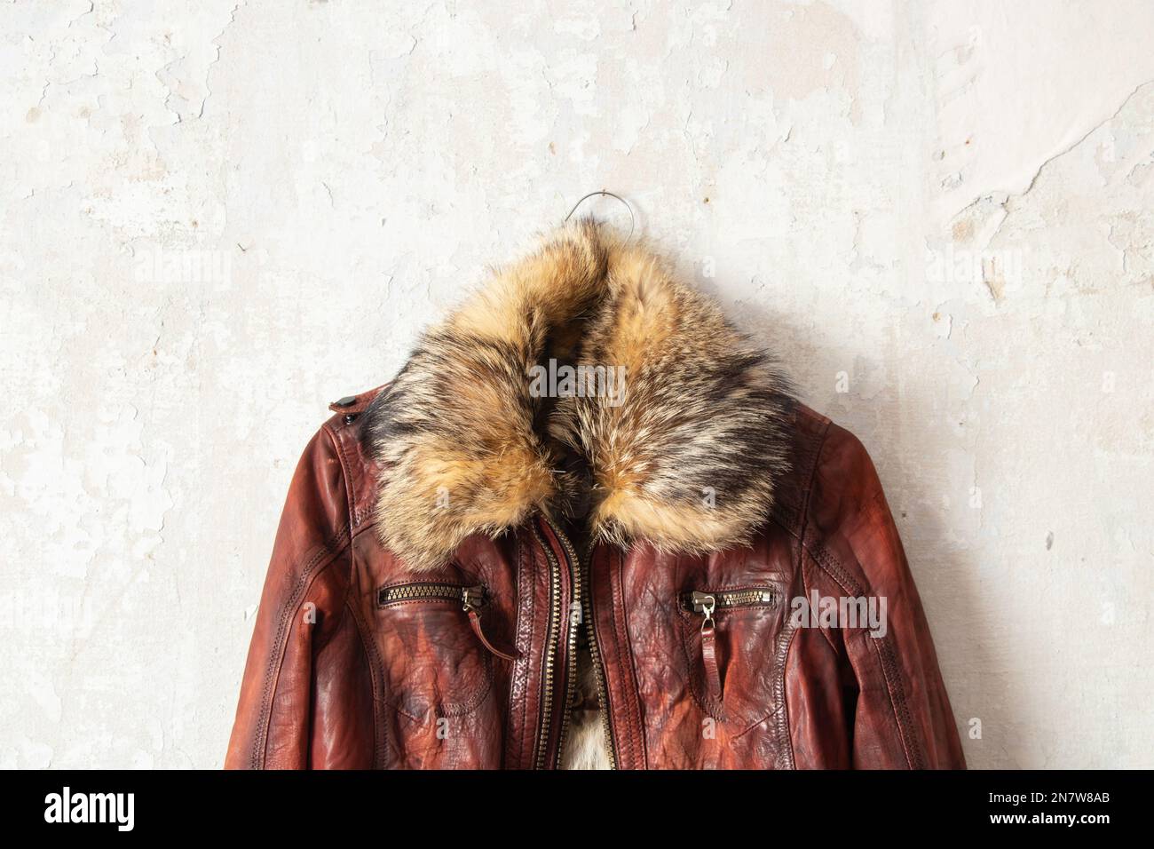 Hanging coat hi-res stock photography and images - Alamy