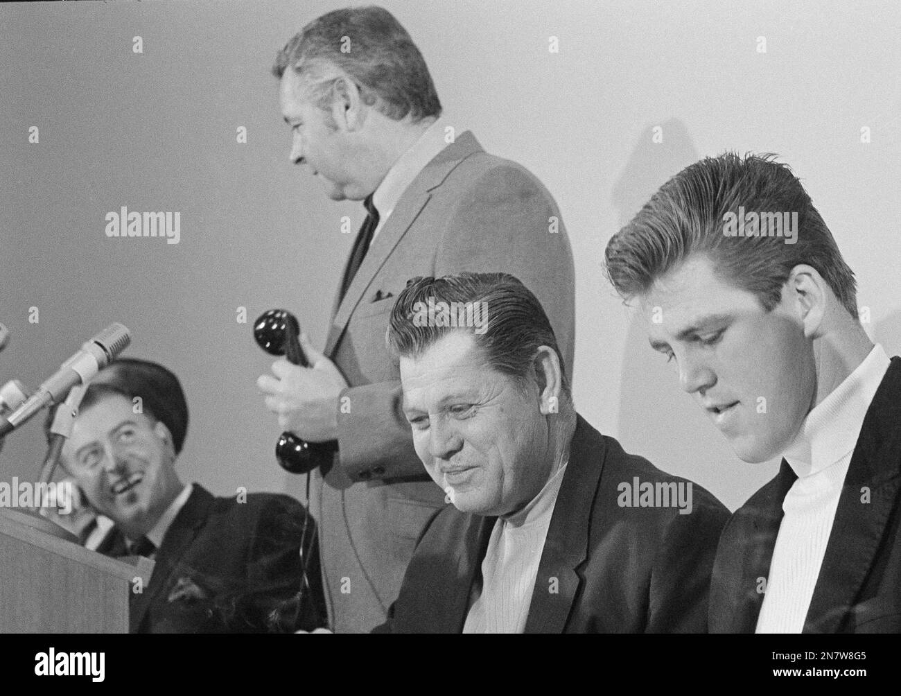 Heavyweight boxer Jerry Quarry, right, his father Jack, center, and ...