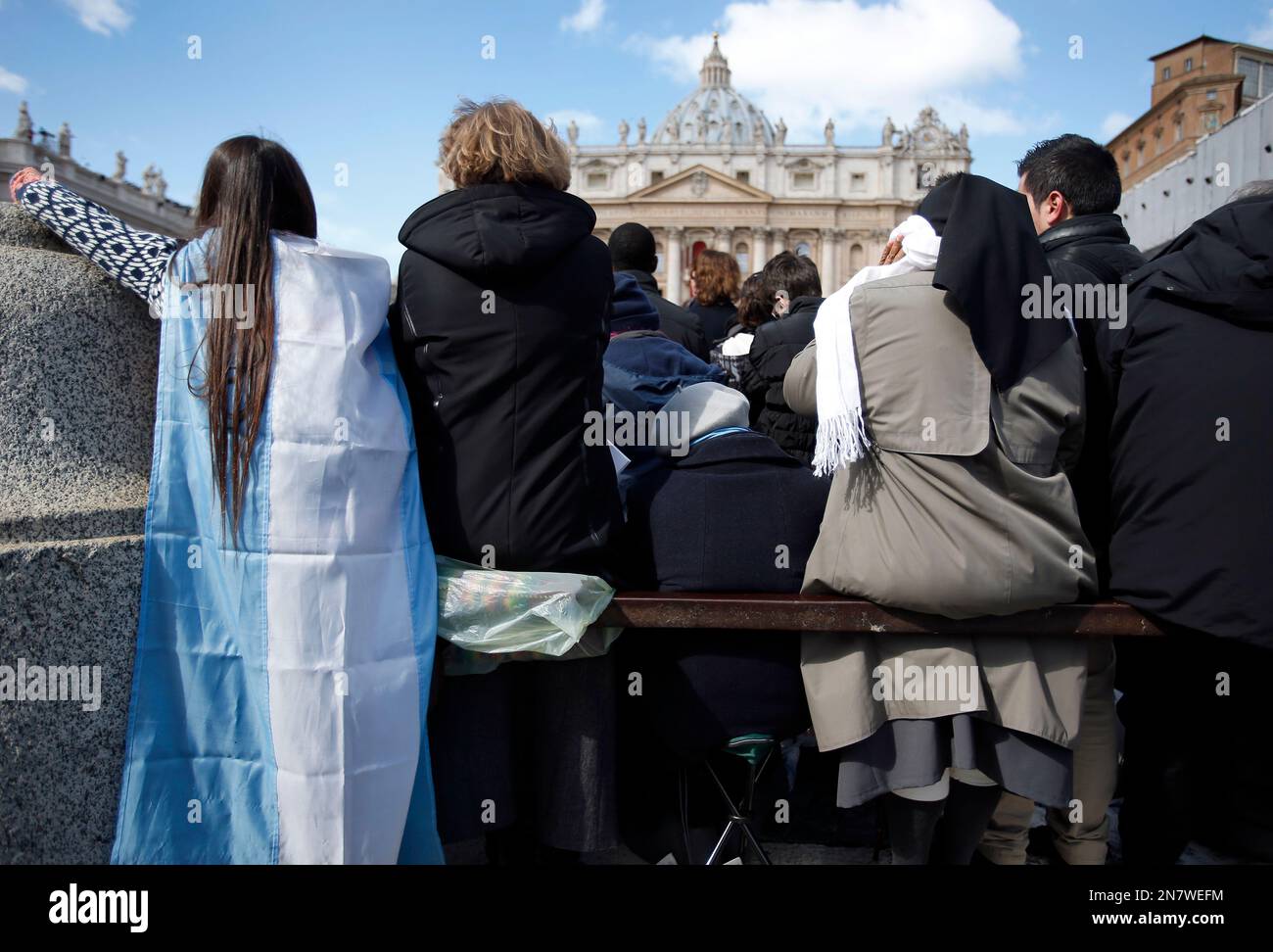 People attend the inauguration mass of Pope Francis at the Vatican ...