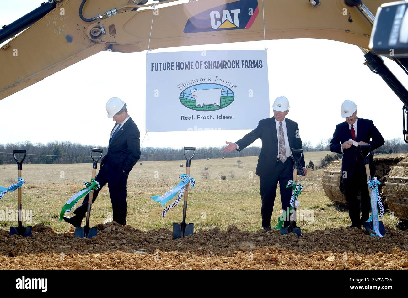 Virginia Governor Bob McDonnell, left, kicks some loose dirt while ...