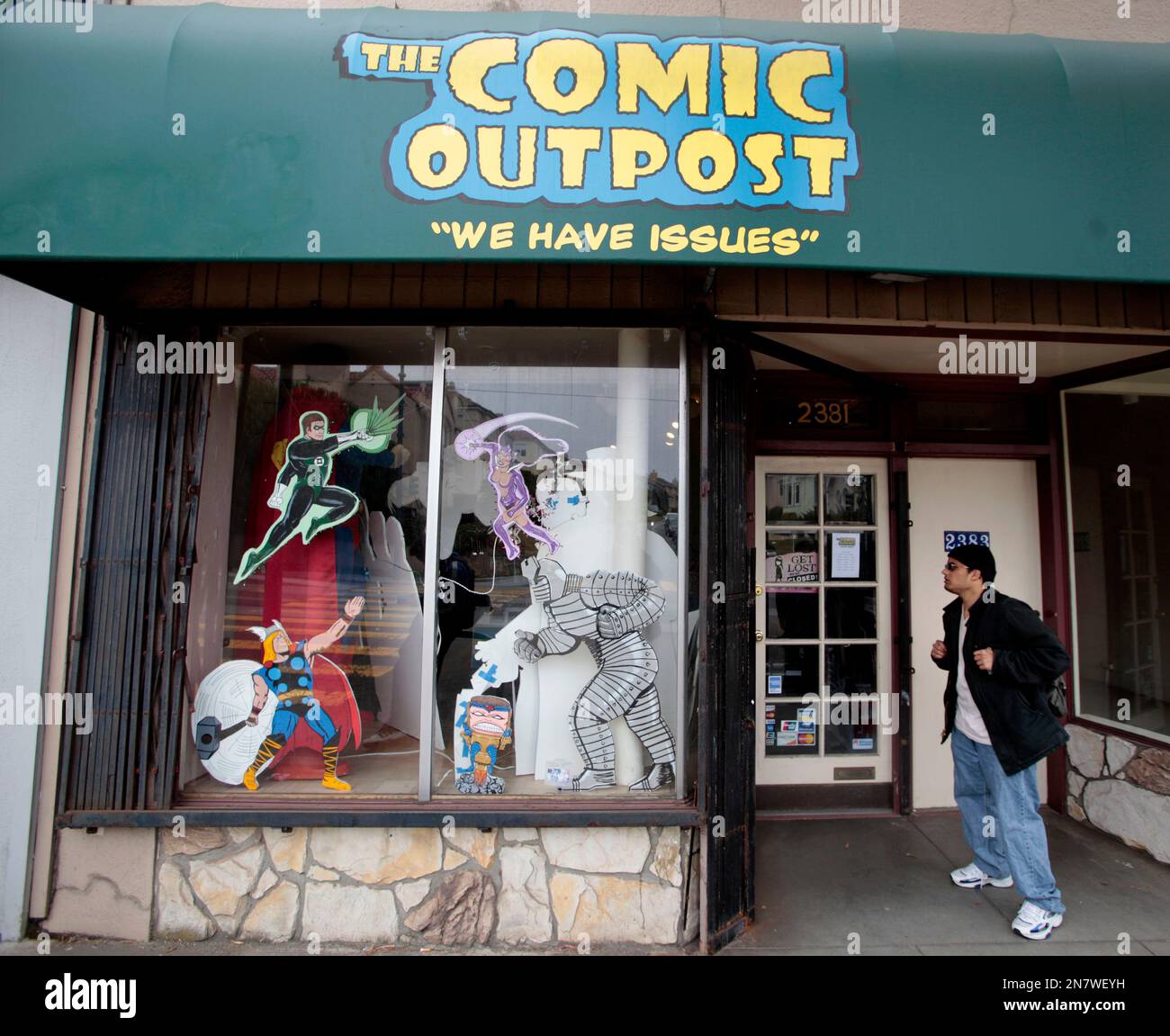 Eddy Morales waits for the Comic Outpost store to open so he can ...
