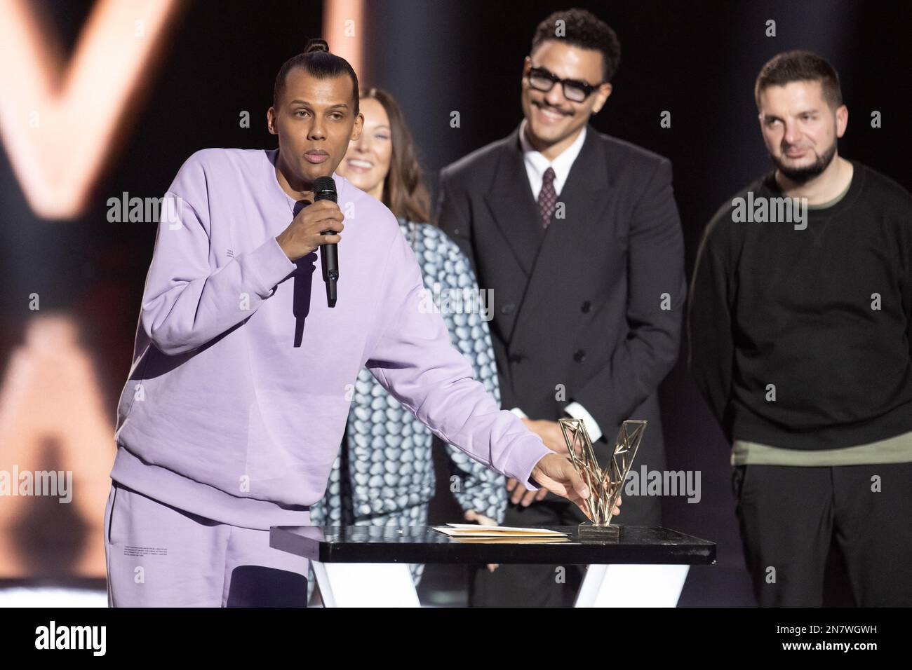 Stromae receives the Best Album award on stage with Coralie Barbier and ...