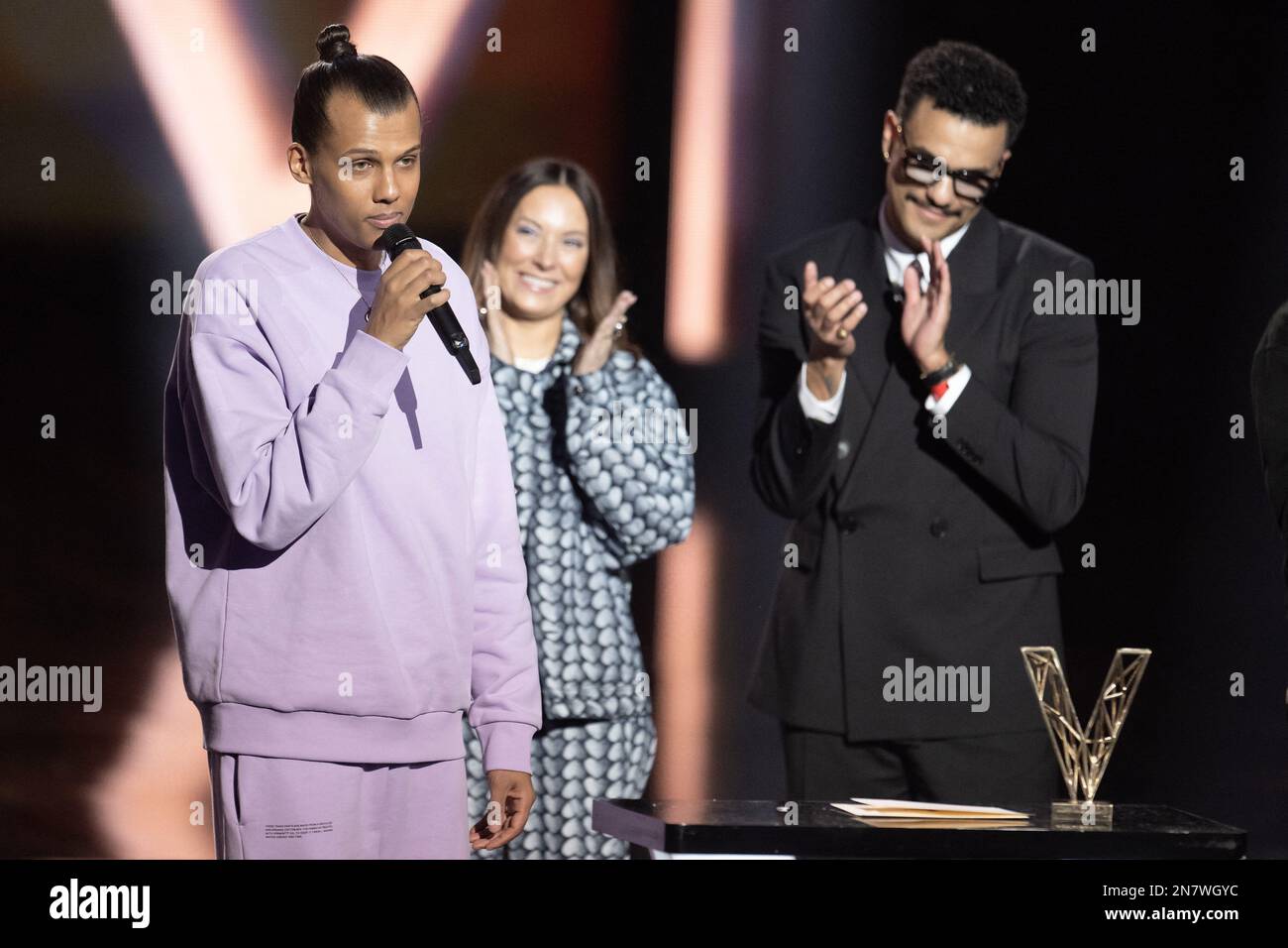Stromae receives the Best Album award on stage with Coralie Barbier and ...