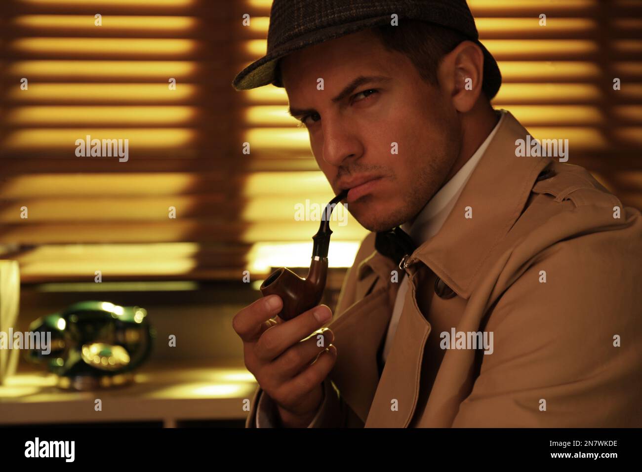 Old fashioned detective with smoking pipe in office Stock Photo - Alamy