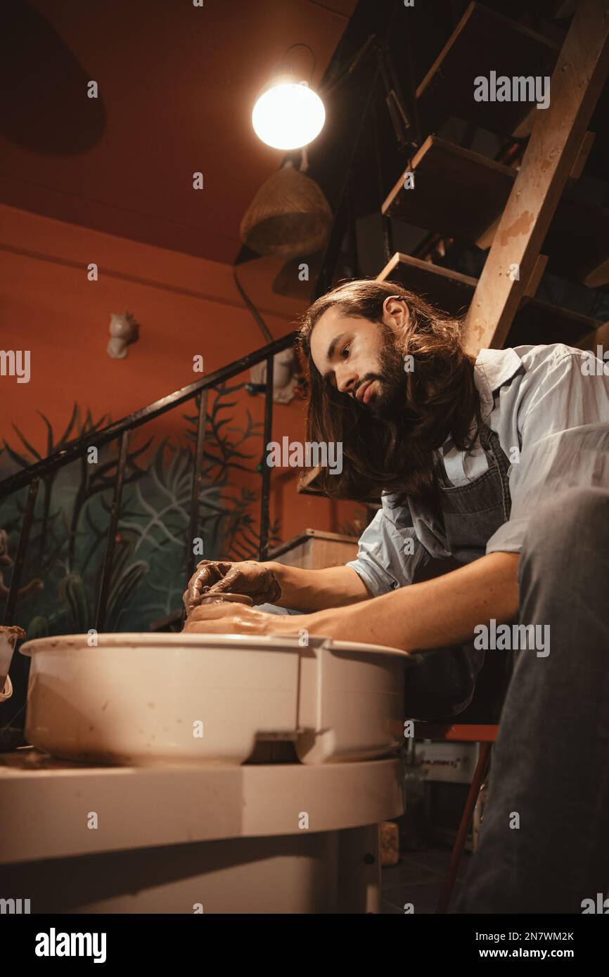 pottery man master work sculpting clay cup. handcraft pot artist maker ...