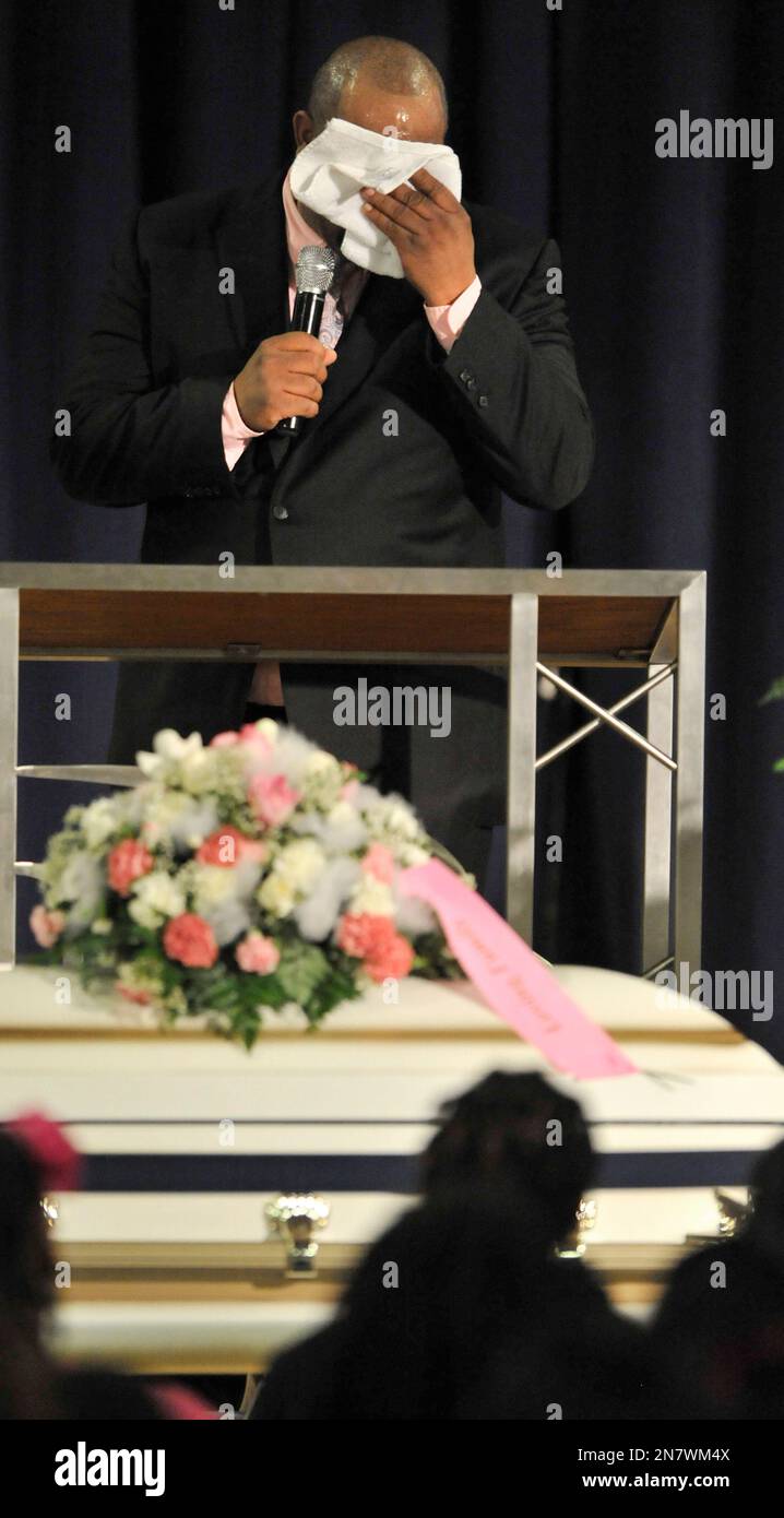Rev. Corey Brooks wipes his face while speaking during six-month old ...