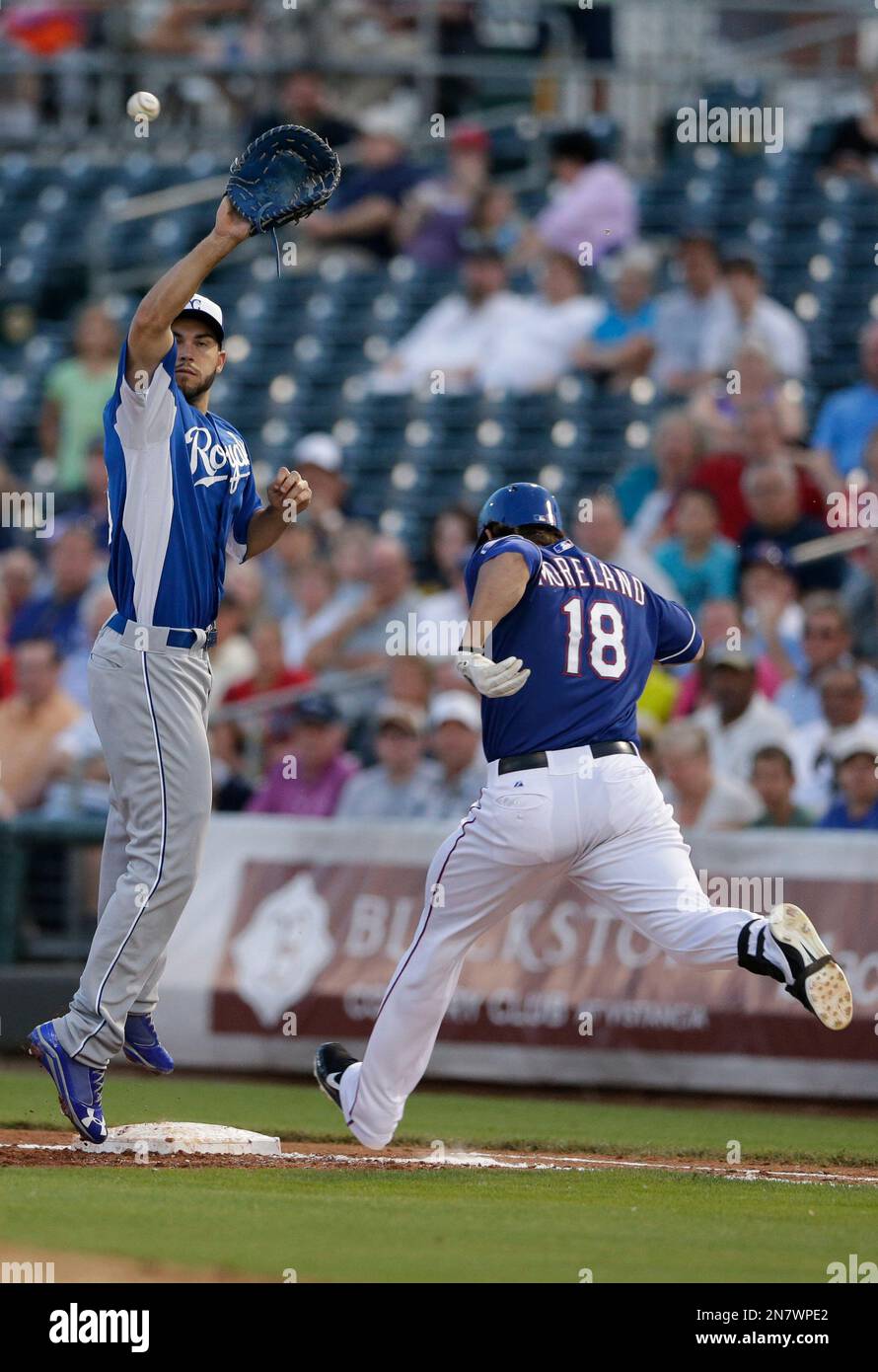 Kansas City Royals first baseman Eric Hosmer, left, leaps off the bag ...