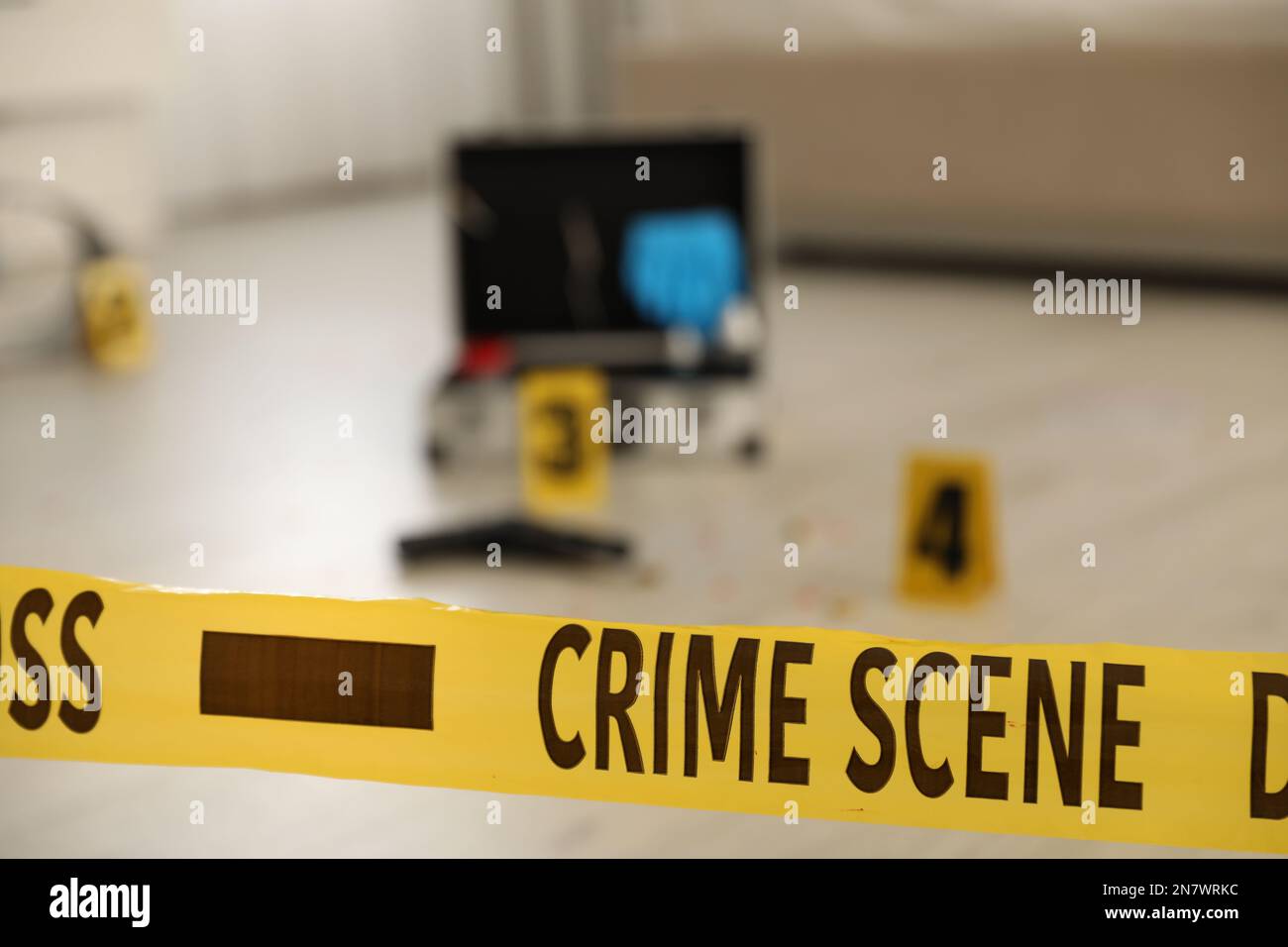 Crime scene with evidences and criminologist case, focus on yellow tape ...