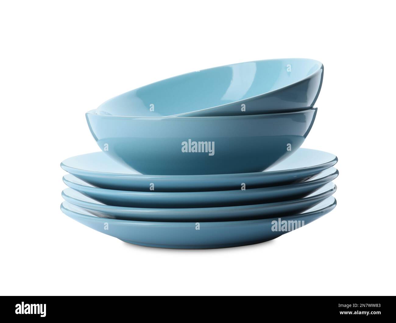 Stack of clean plates and bowls on white background Stock Photo - Alamy