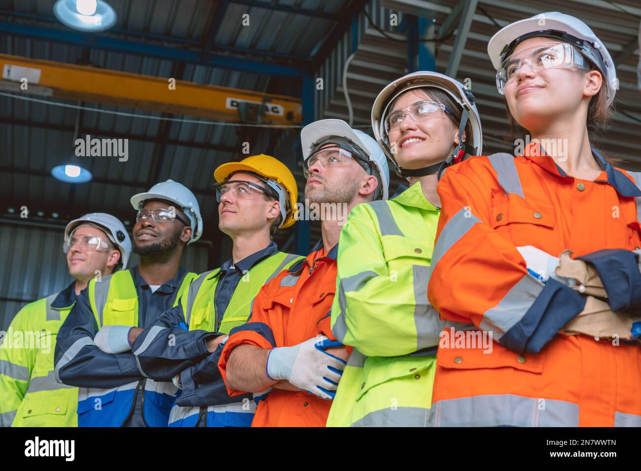 people group of engineer technician and service team worker in safety suit standing together ...