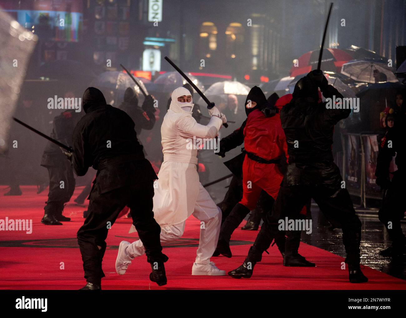 Stuntmen dressed as Ninjas, stage a fight scene on the red carpet for ...