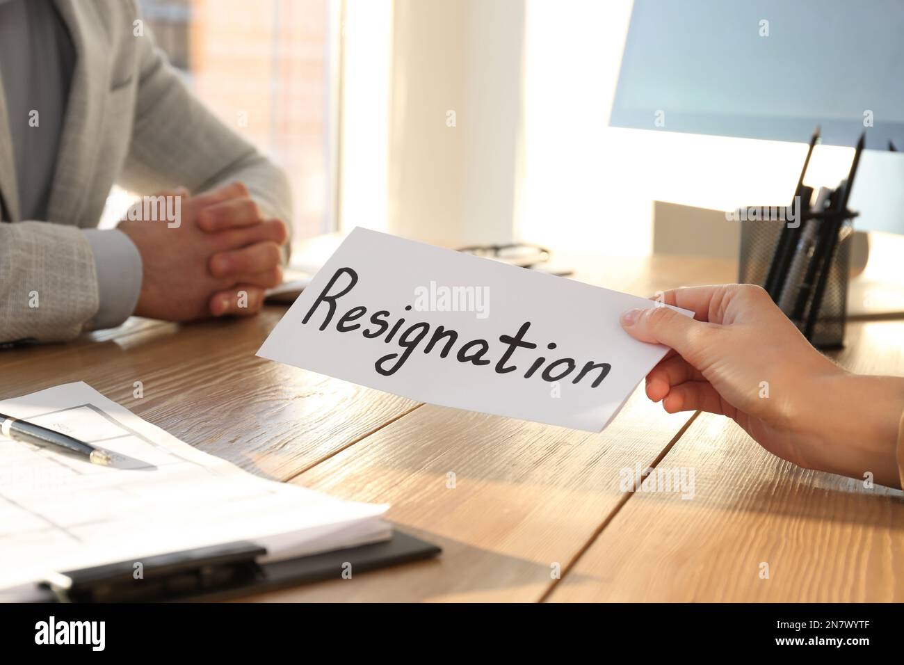 Employee giving resignation letter to boss in office, closeup Stock ...
