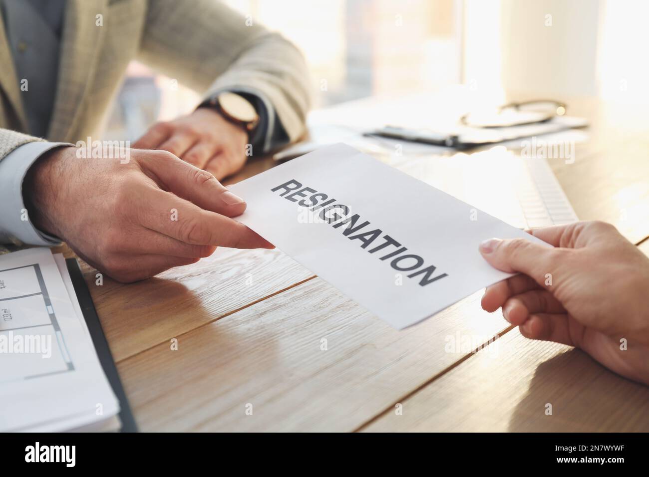 Employee giving resignation letter to boss in office, closeup Stock ...