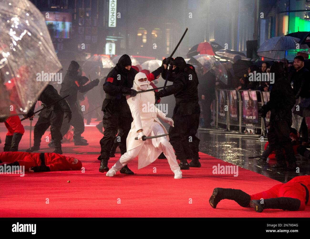 Stuntmen dressed as Ninjas, stage a fight scene on the red carpet for ...