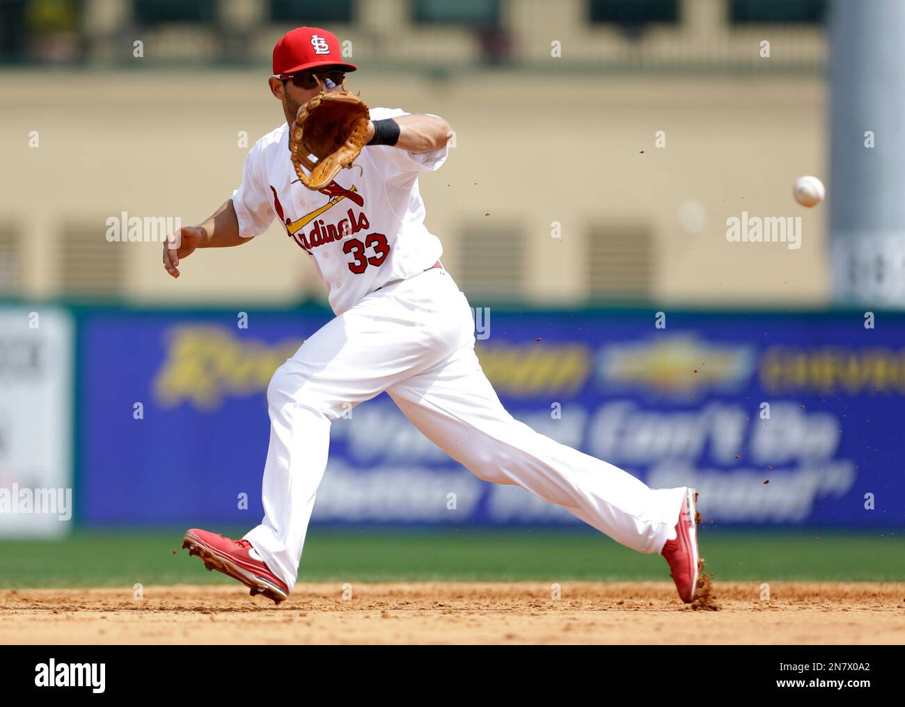 St. Louis Cardinals shortstop Daniel Descalso handles a grounder hit by ...