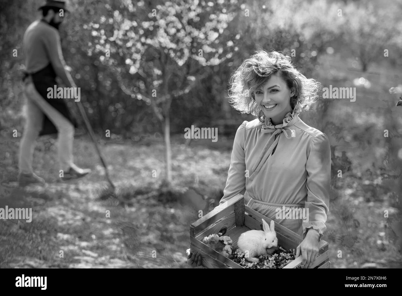 Gardening in spring - happy couple harvesting and having lots of fun ...