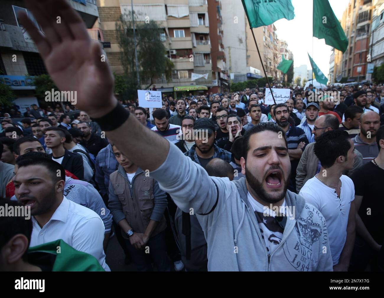 Lebanese Sunni protesters chant religious slogans, during a protest ...