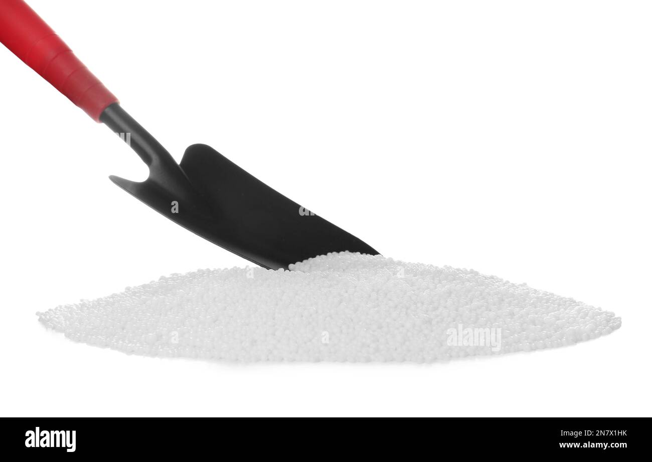 Pile of granular mineral fertilizer and scoop on white background Stock ...
