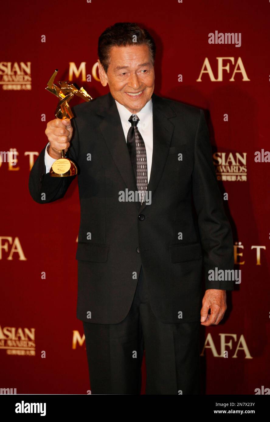 The Philippines actor Eddie Garcia poses with his trophy after winning ...