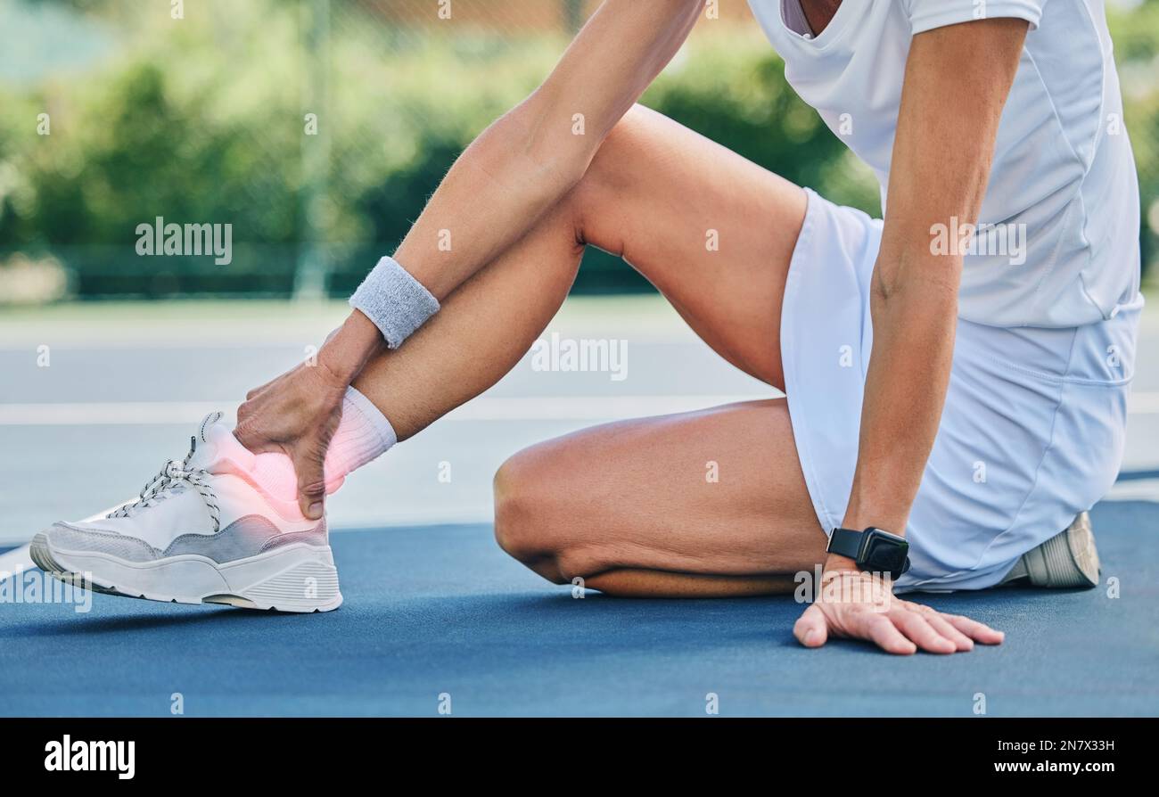 Tennis court, ankle pain and woman on sports ground for healthcare risk ...