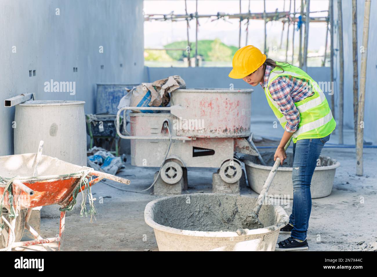 woman labor construction worker working mix concrete hard work at ...
