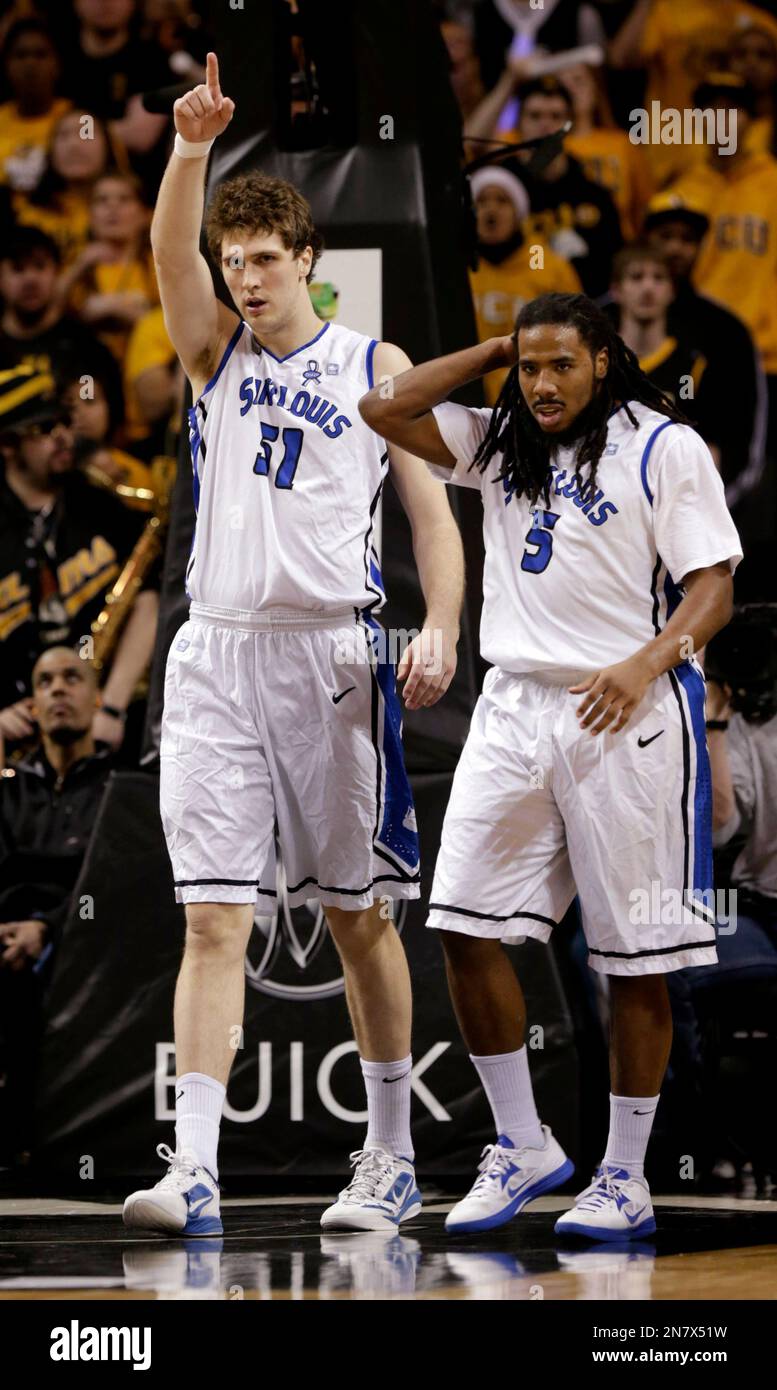 Saint Louis' Rob Loe, left, reacts while walking next to Jordair Jett ...