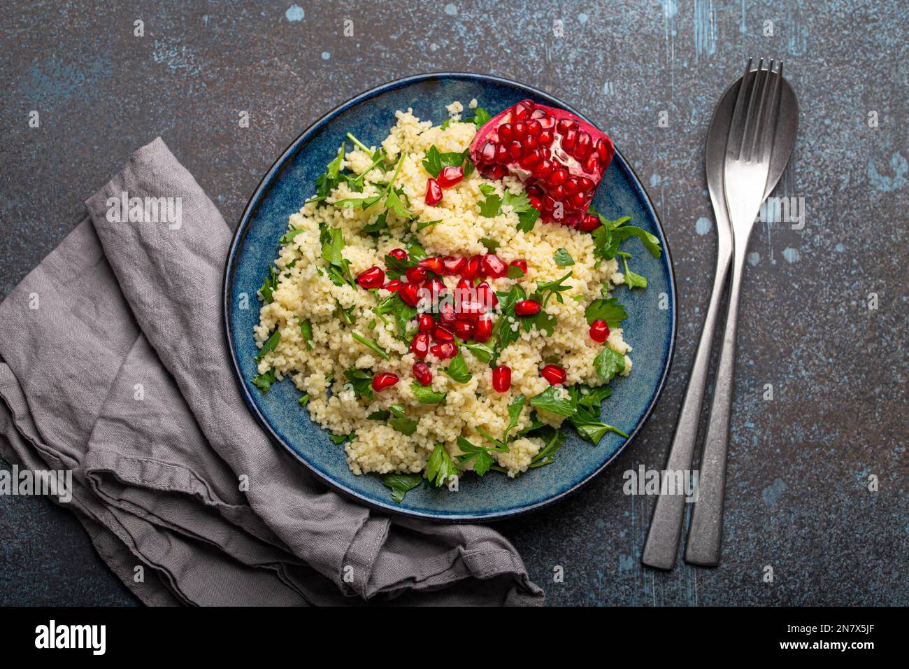 Bright colourful couscous or bulgur salad with pomegranate seeds ...