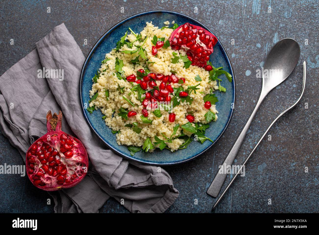 Bright colourful couscous or bulgur salad with pomegranate seeds ...