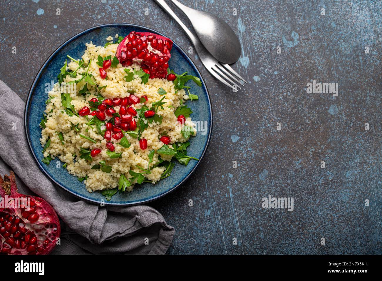 Bright colourful couscous or bulgur salad with pomegranate seeds ...