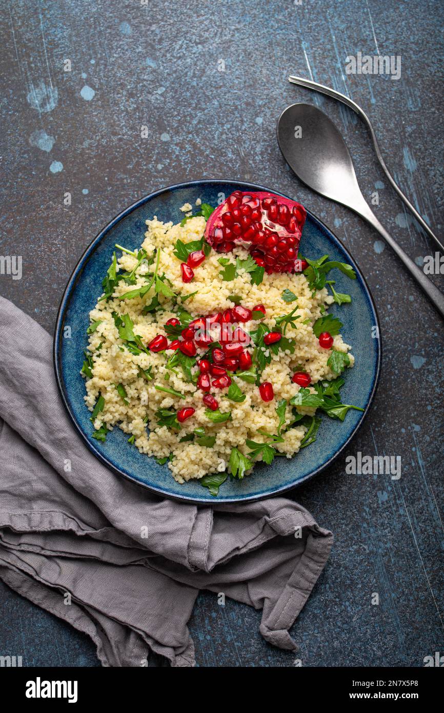 Bright colourful couscous or bulgur salad with pomegranate seeds ...