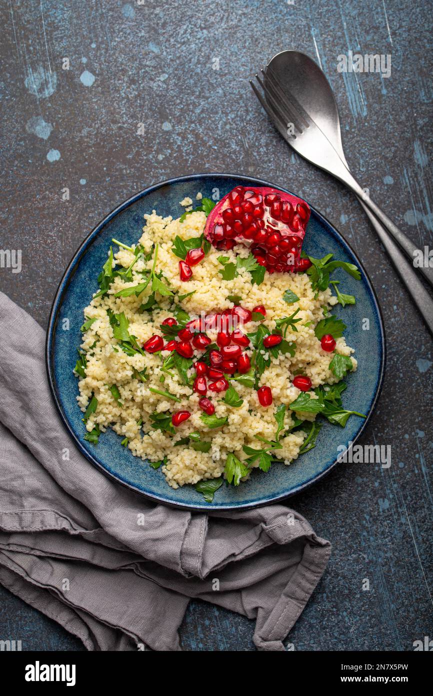 Bright colourful couscous or bulgur salad with pomegranate seeds ...