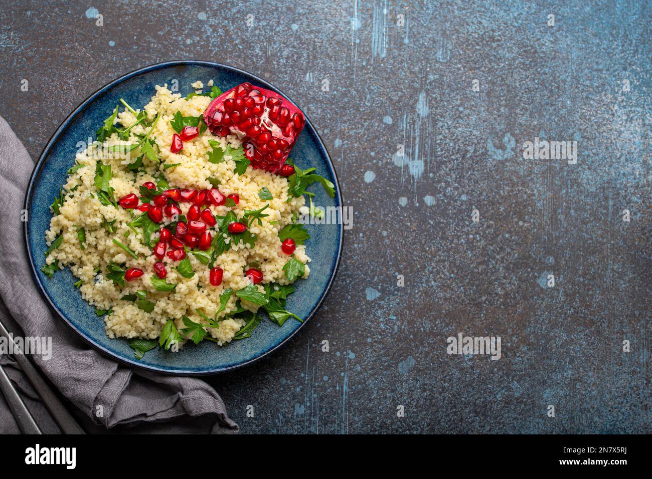 Bright colourful couscous or bulgur salad with pomegranate seeds ...