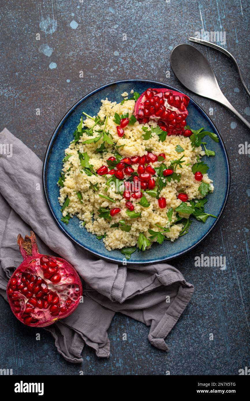 Bright colourful couscous or bulgur salad with pomegranate seeds ...
