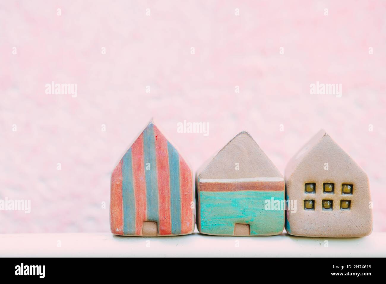 cute small house toy with pink copy space for text for postcard home ...