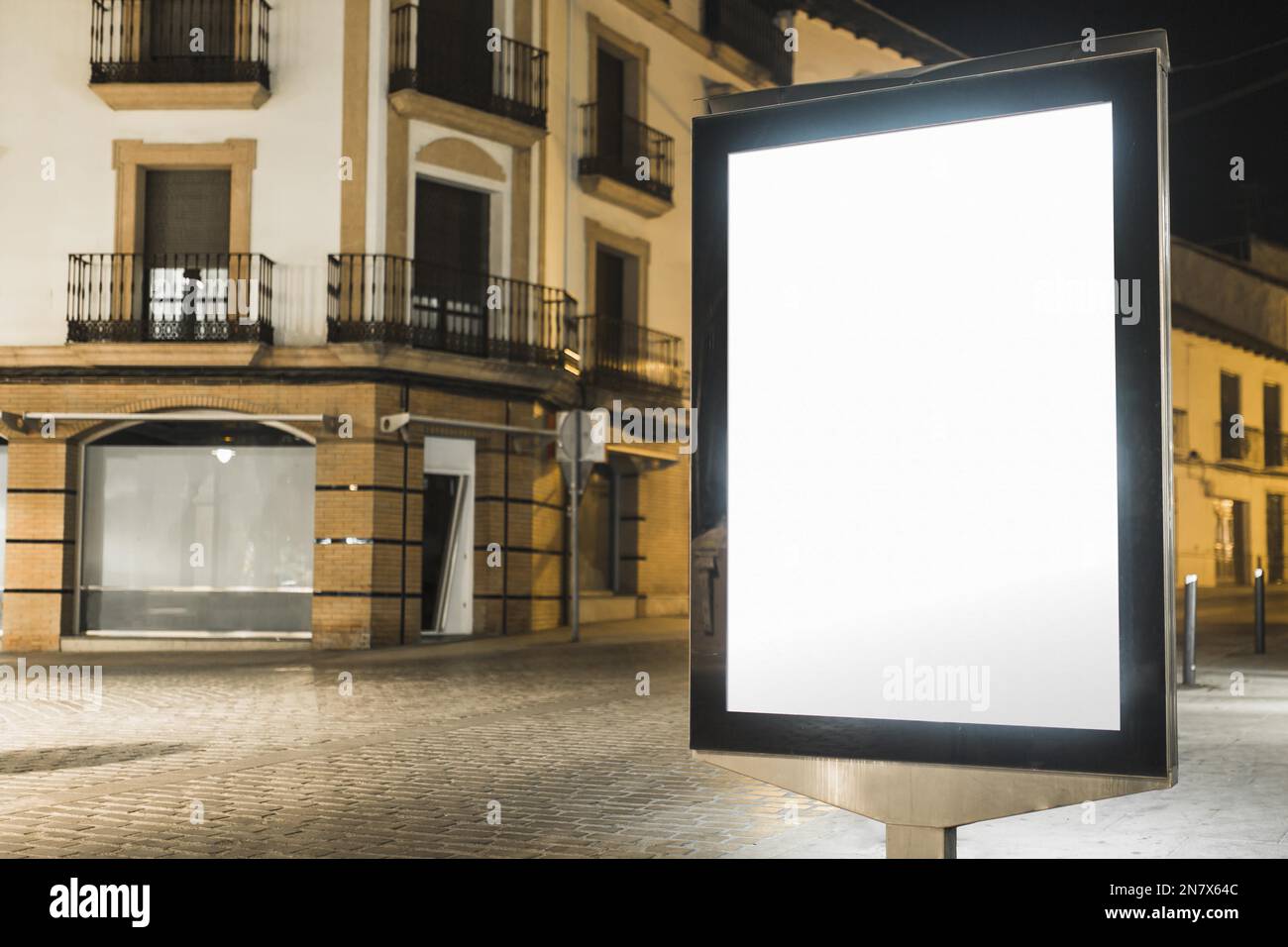 illuminated lightbox billboard near apartment building Stock Photo - Alamy