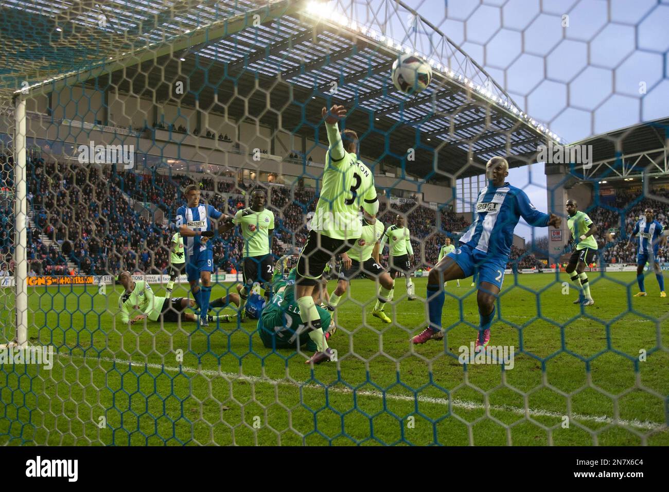 Wigan Athletic's Arouna Kone, third right, scores the winning goal in ...