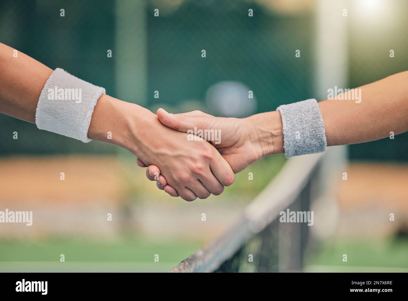 Hand, tennis and handshake for partnership, unity or greeting in ...