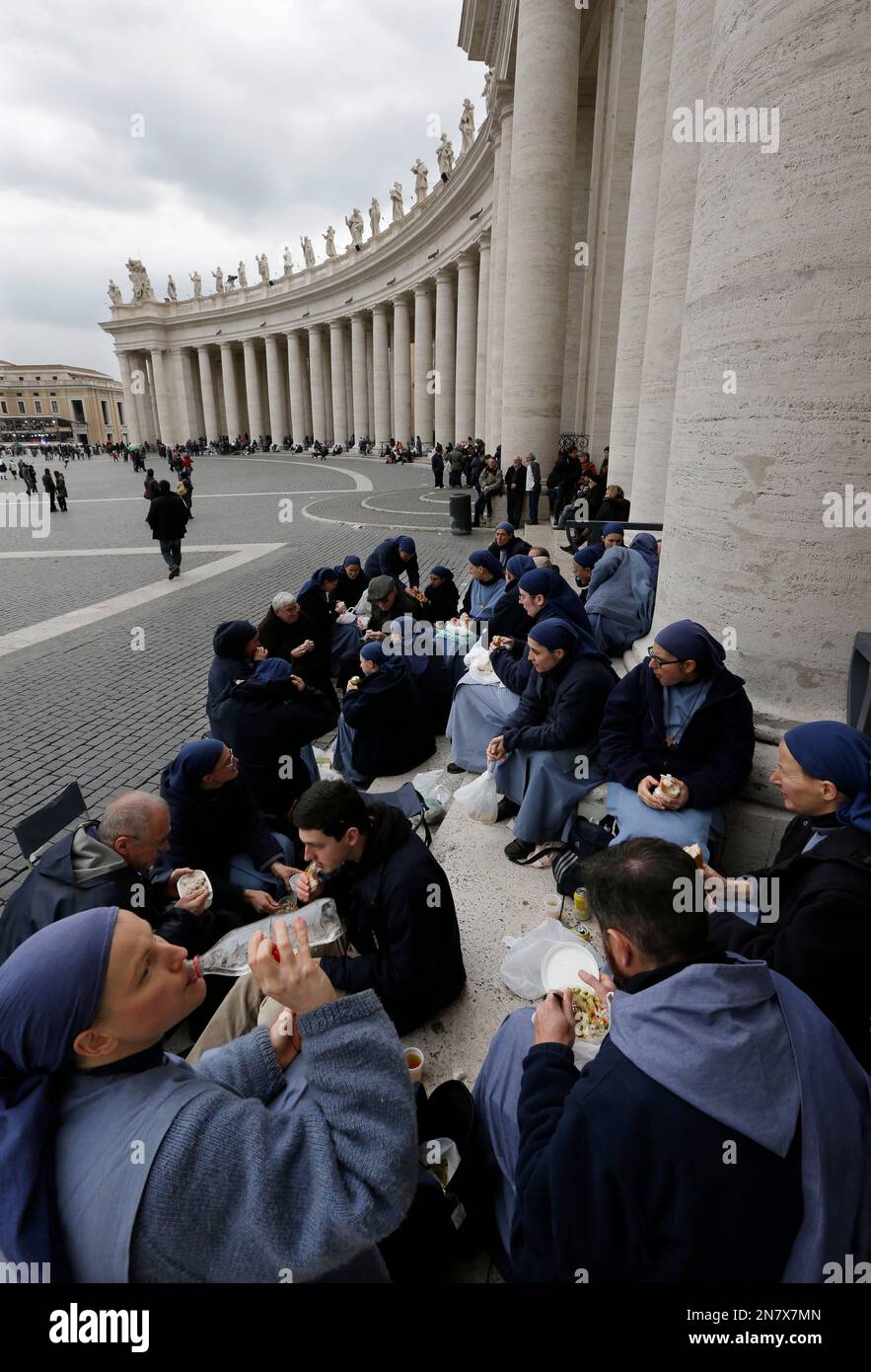 Catholic nuns and brothers eat lunch near the Bernini Colonnade in St ...